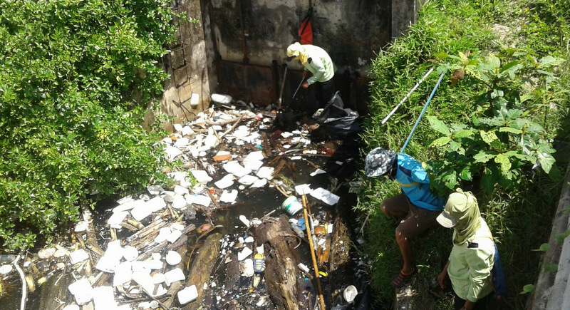 Trash-clogged canal near Phuket beach cleared