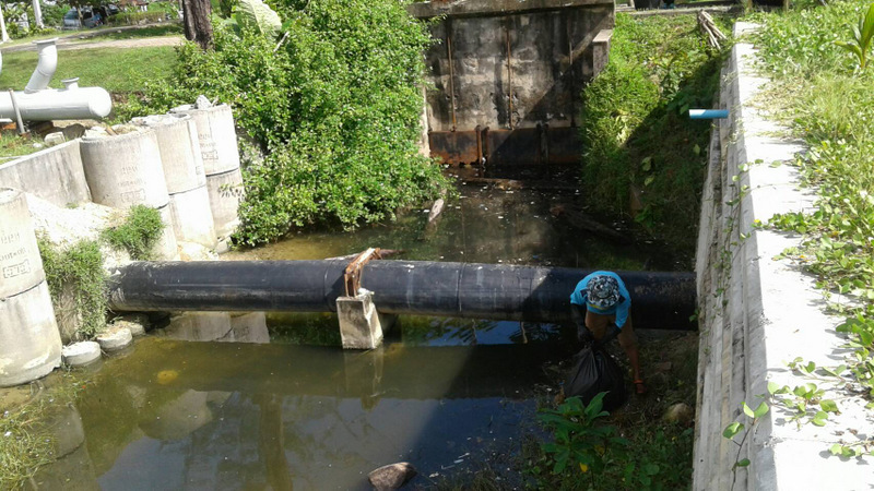 Trash-clogged canal near Phuket beach cleared