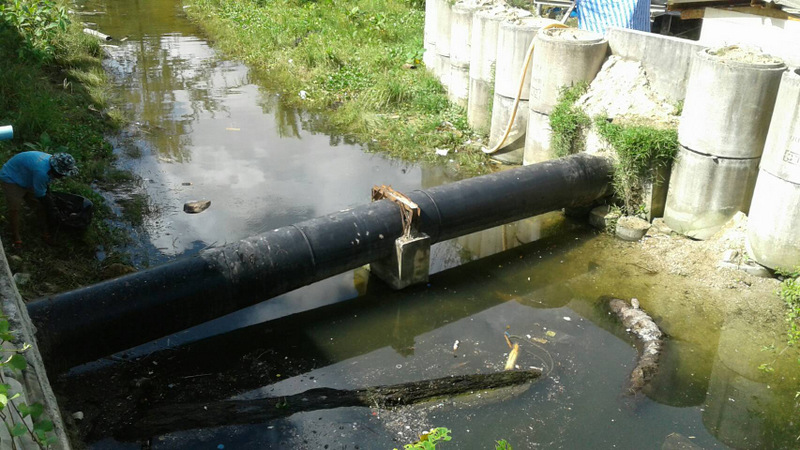 Trash-clogged canal near Phuket beach cleared